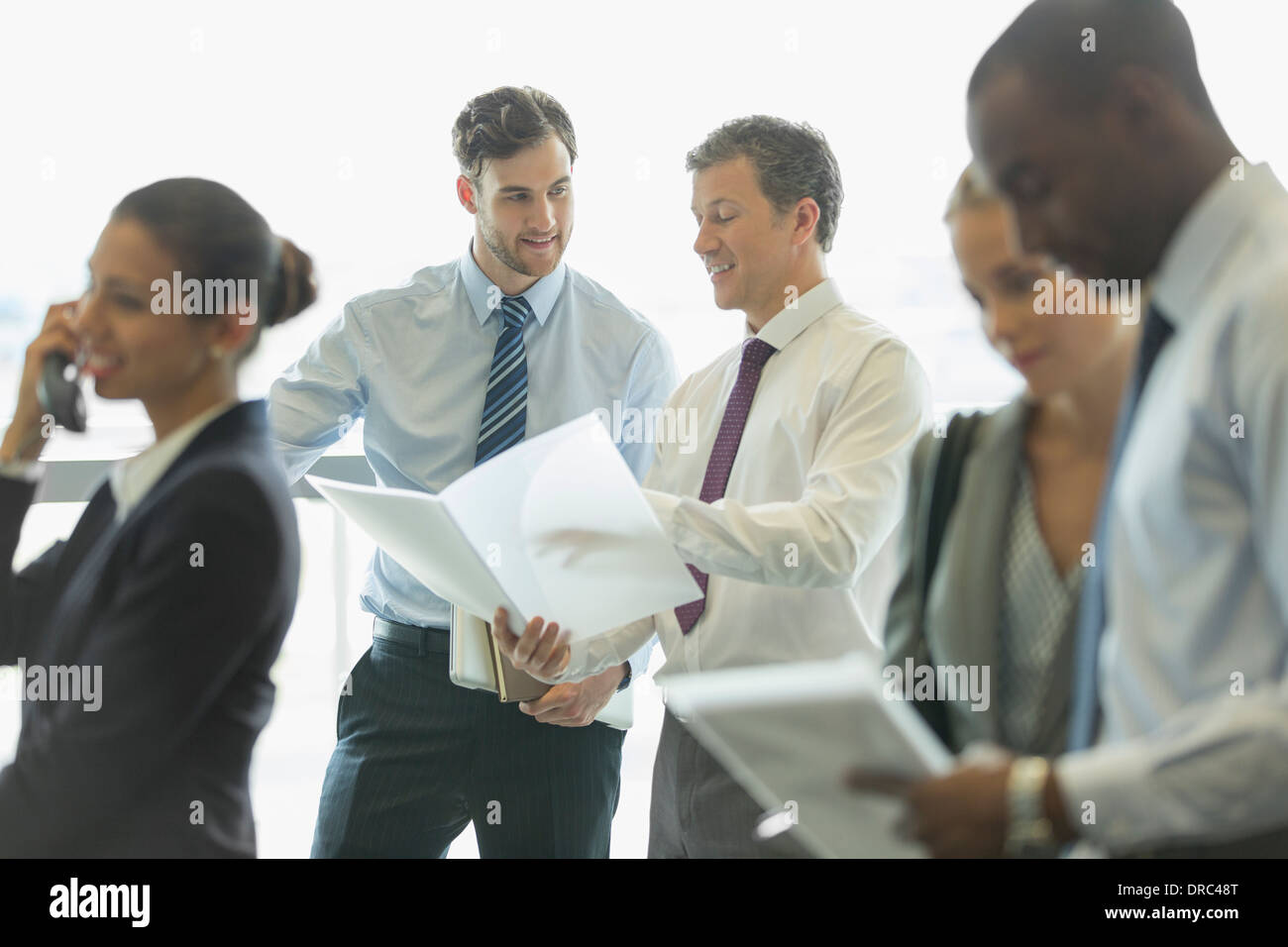 Woman looking businessman talking hi-res stock photography and images ...