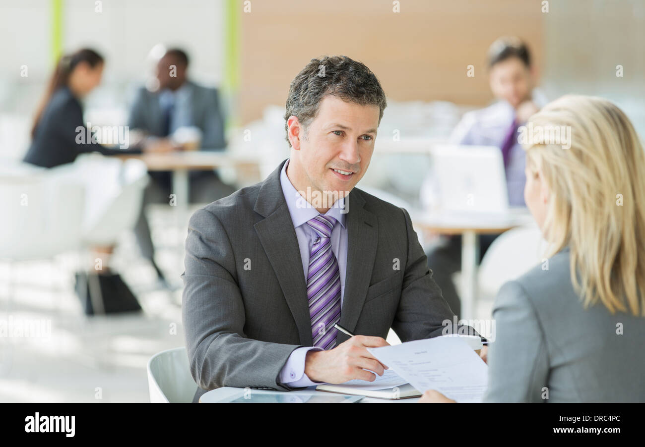 Business people talking in office Stock Photo - Alamy