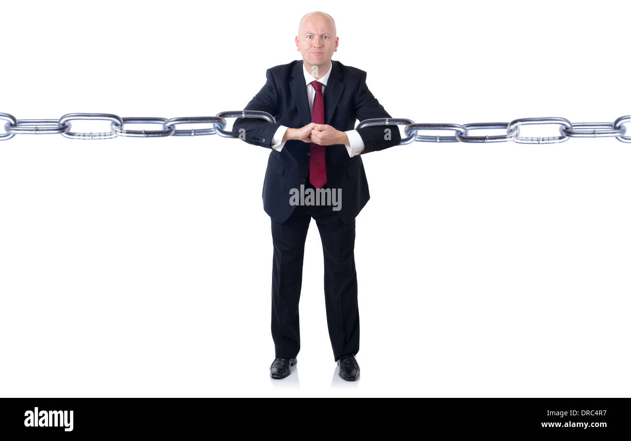 A powerfull businessman holding chains together isolated on a white ...