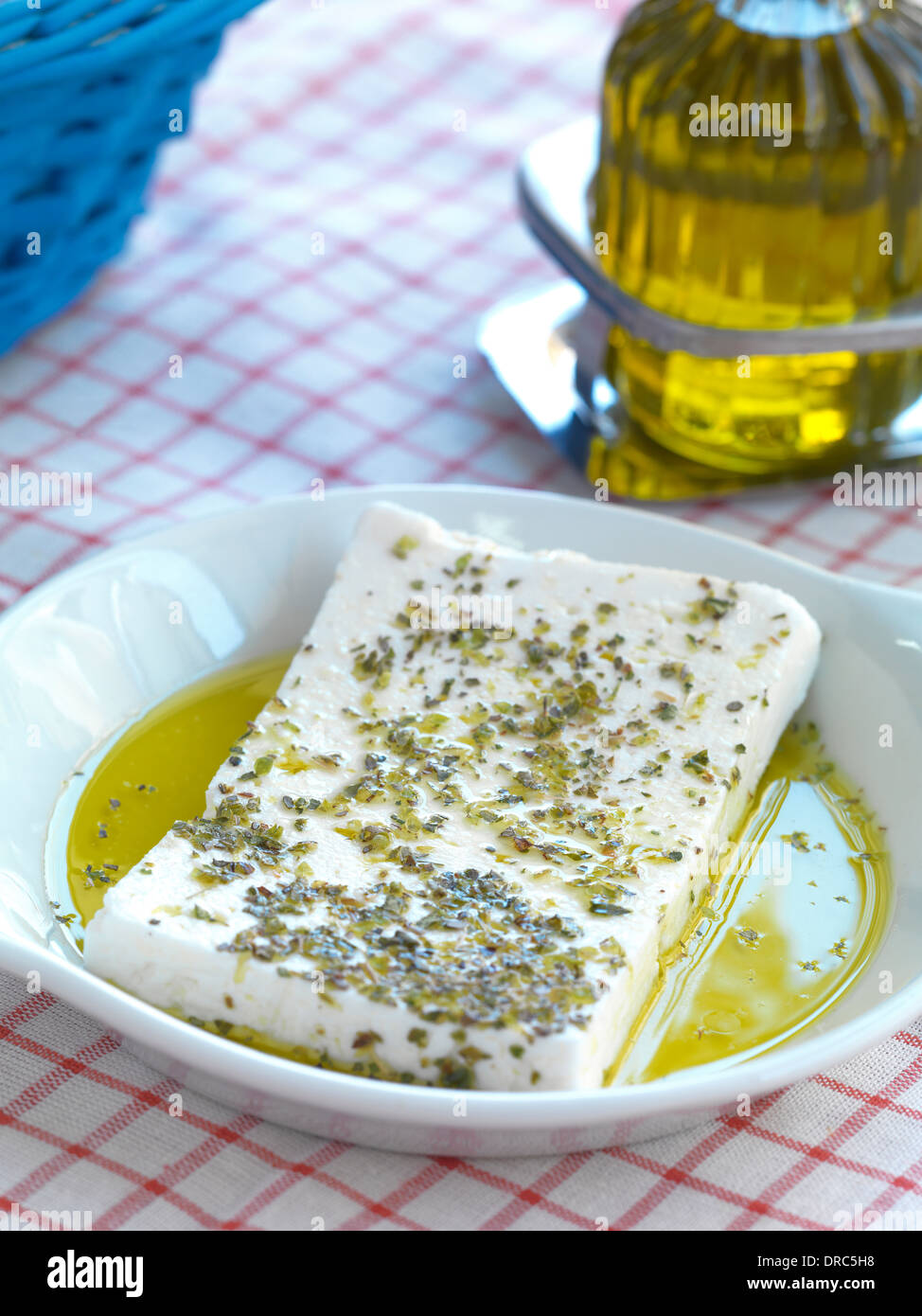 a slice of feta cheese(traditional Greek goat cheese) with virgin olive ...