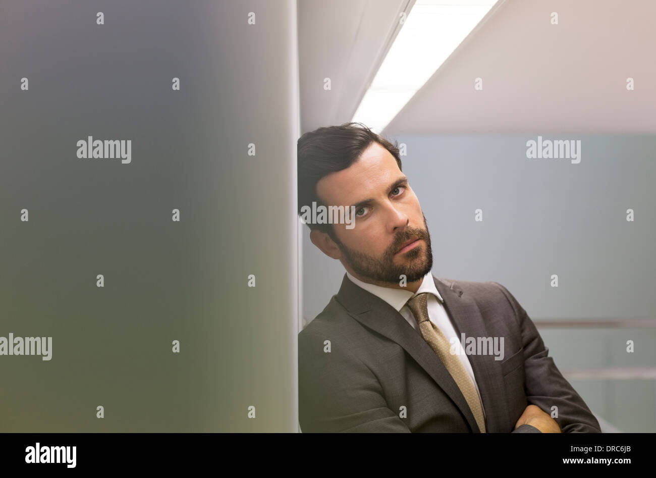 Business man leaning head to wall hi-res stock photography and images ...