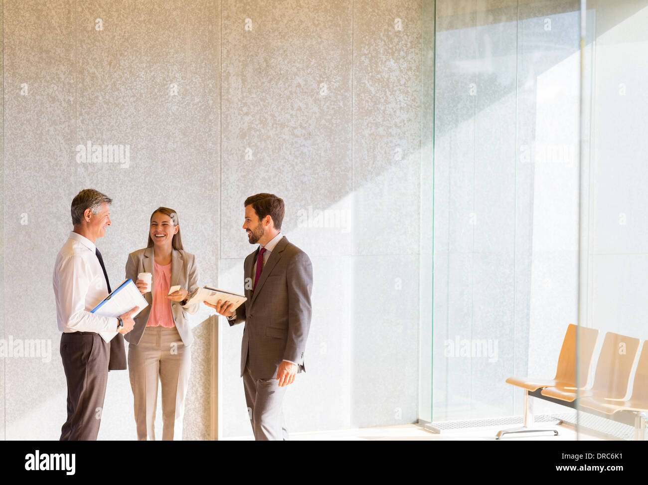 Business people talking in office Stock Photo - Alamy