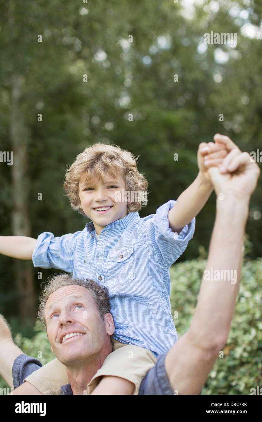 Father carrying son on shoulder hi-res stock photography and images - Alamy