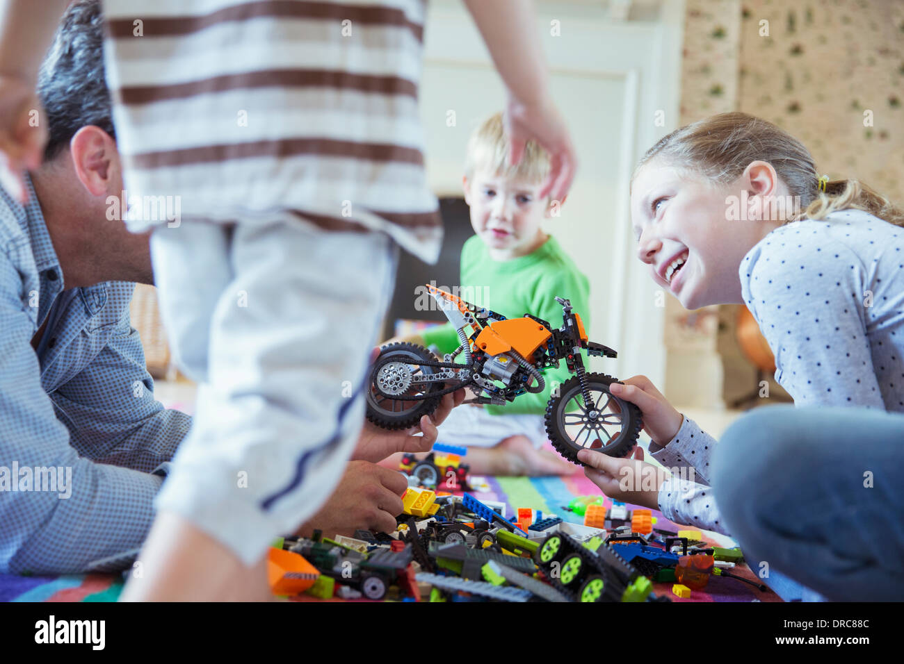 Father and children playing together Stock Photo - Alamy
