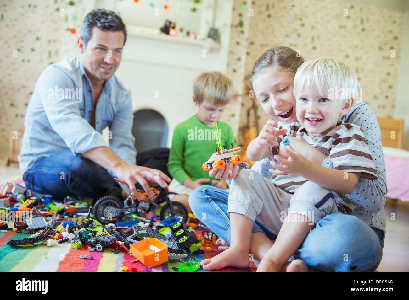 Father and children playing together Stock Photo - Alamy