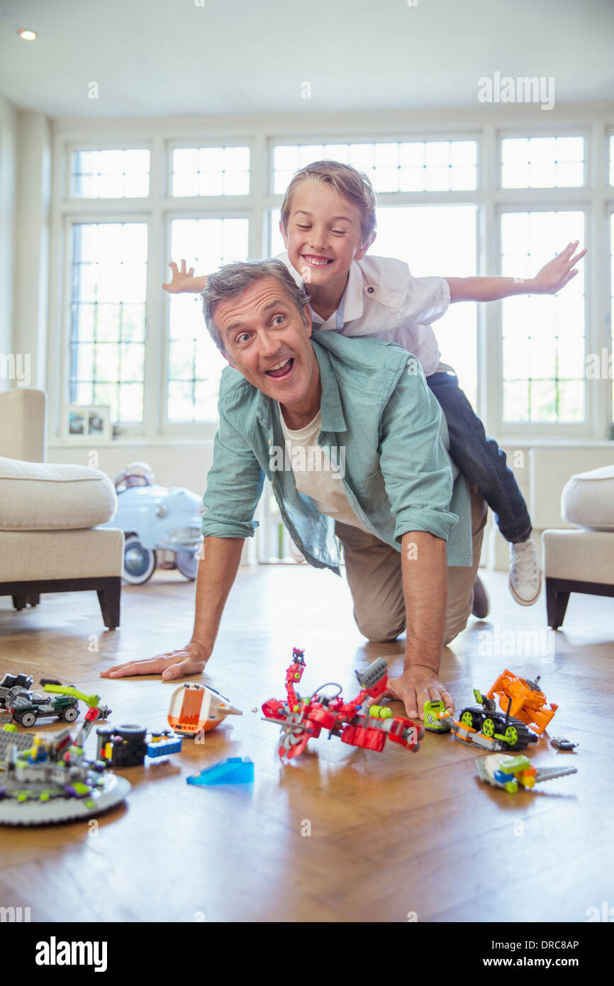 Father and son playing together Stock Photo - Alamy