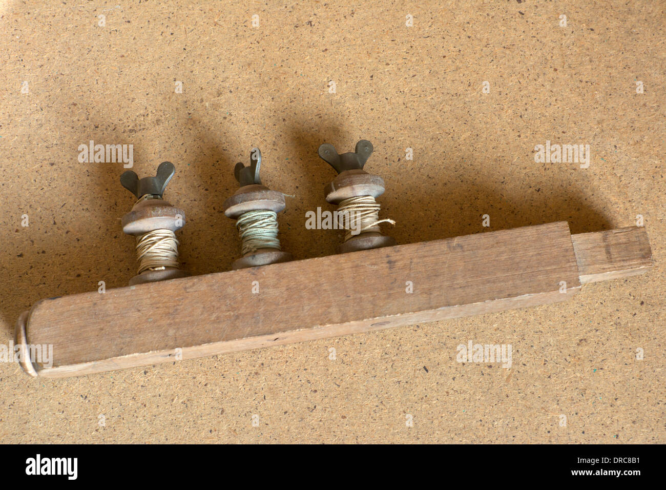 Hair preparation - reel thread holder Stock Photo - Alamy