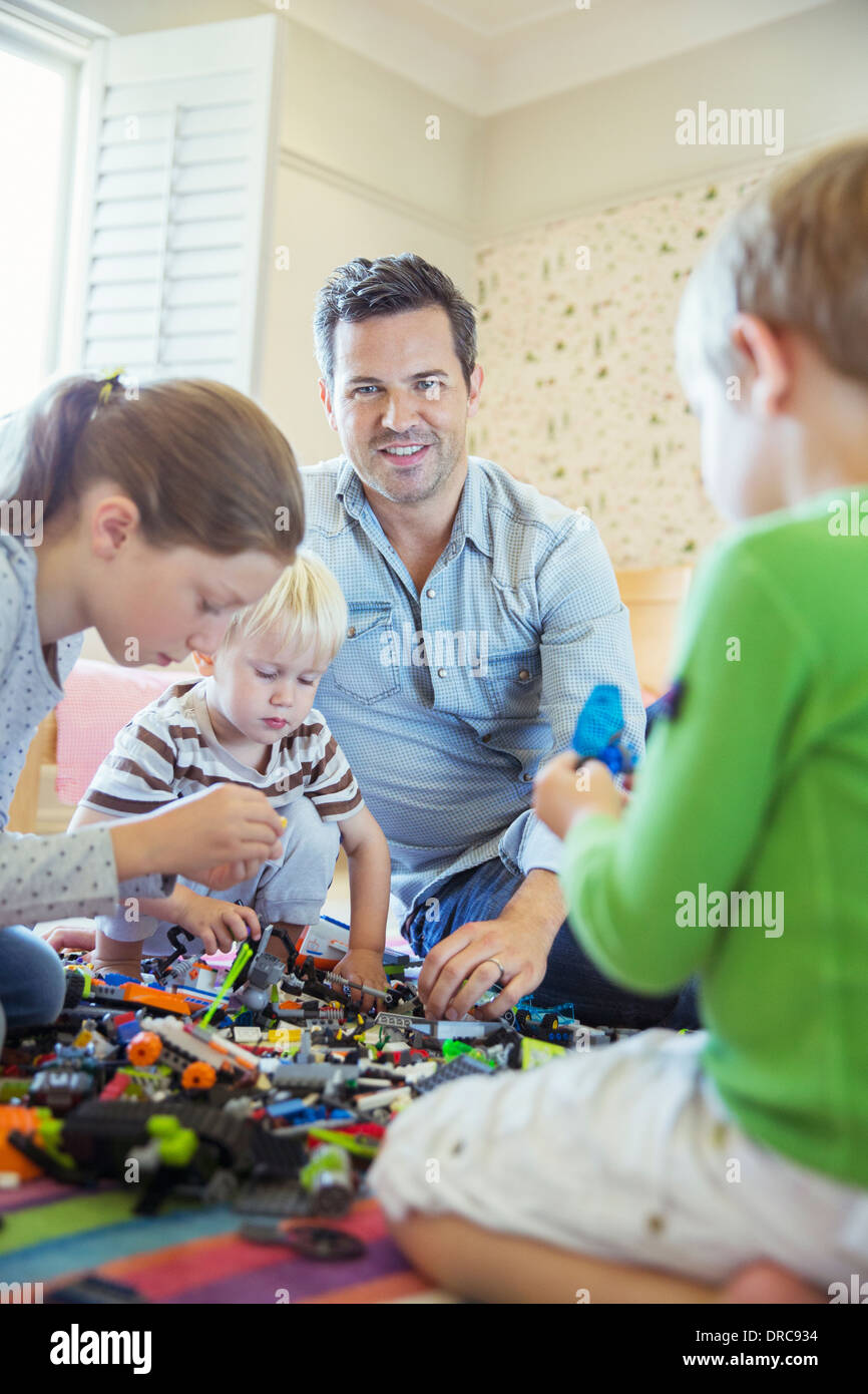 Father playing with children Stock Photo - Alamy