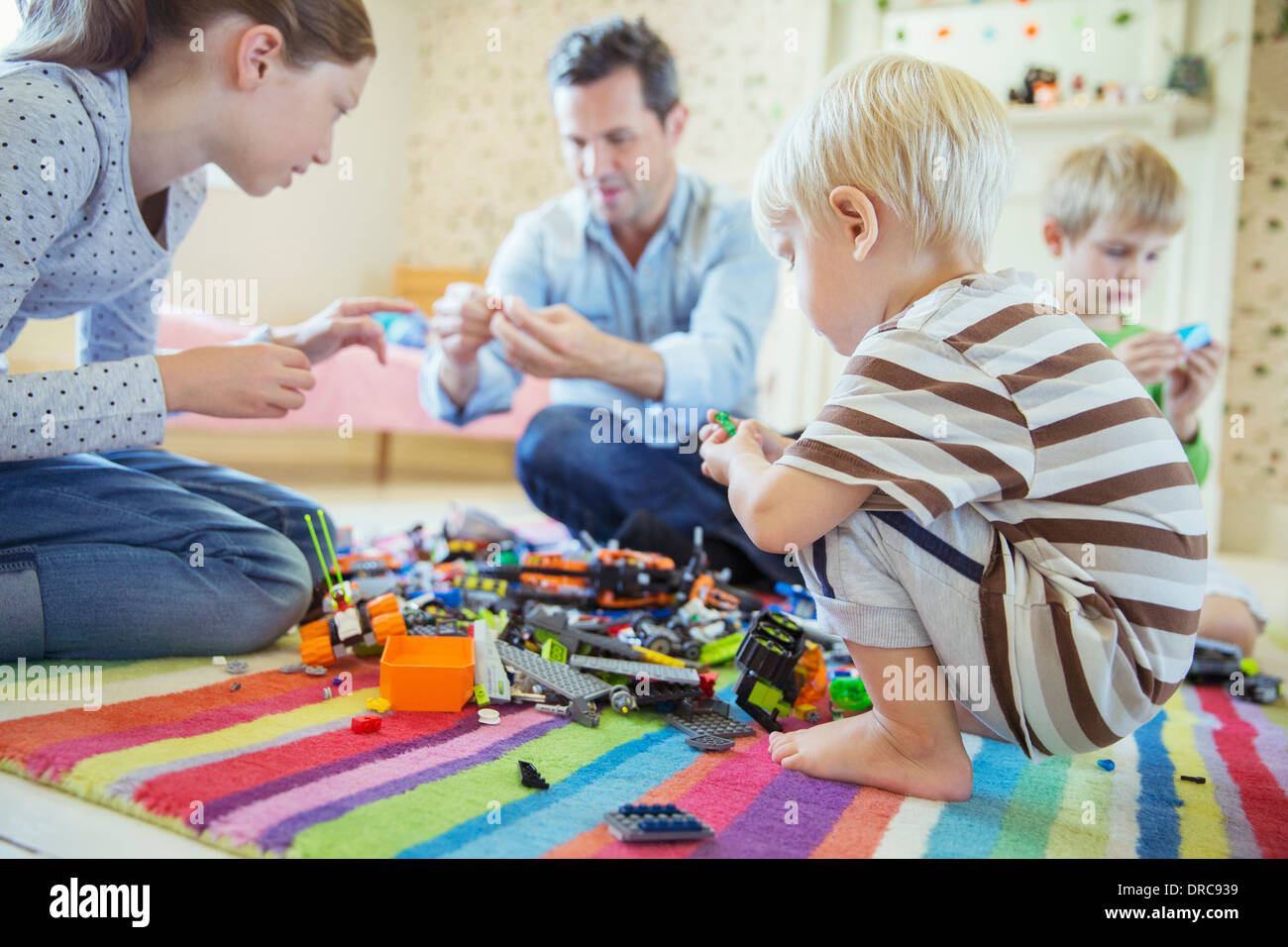 Father playing with children Stock Photo - Alamy