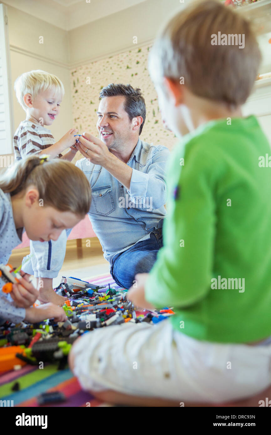 Father playing with children Stock Photo - Alamy