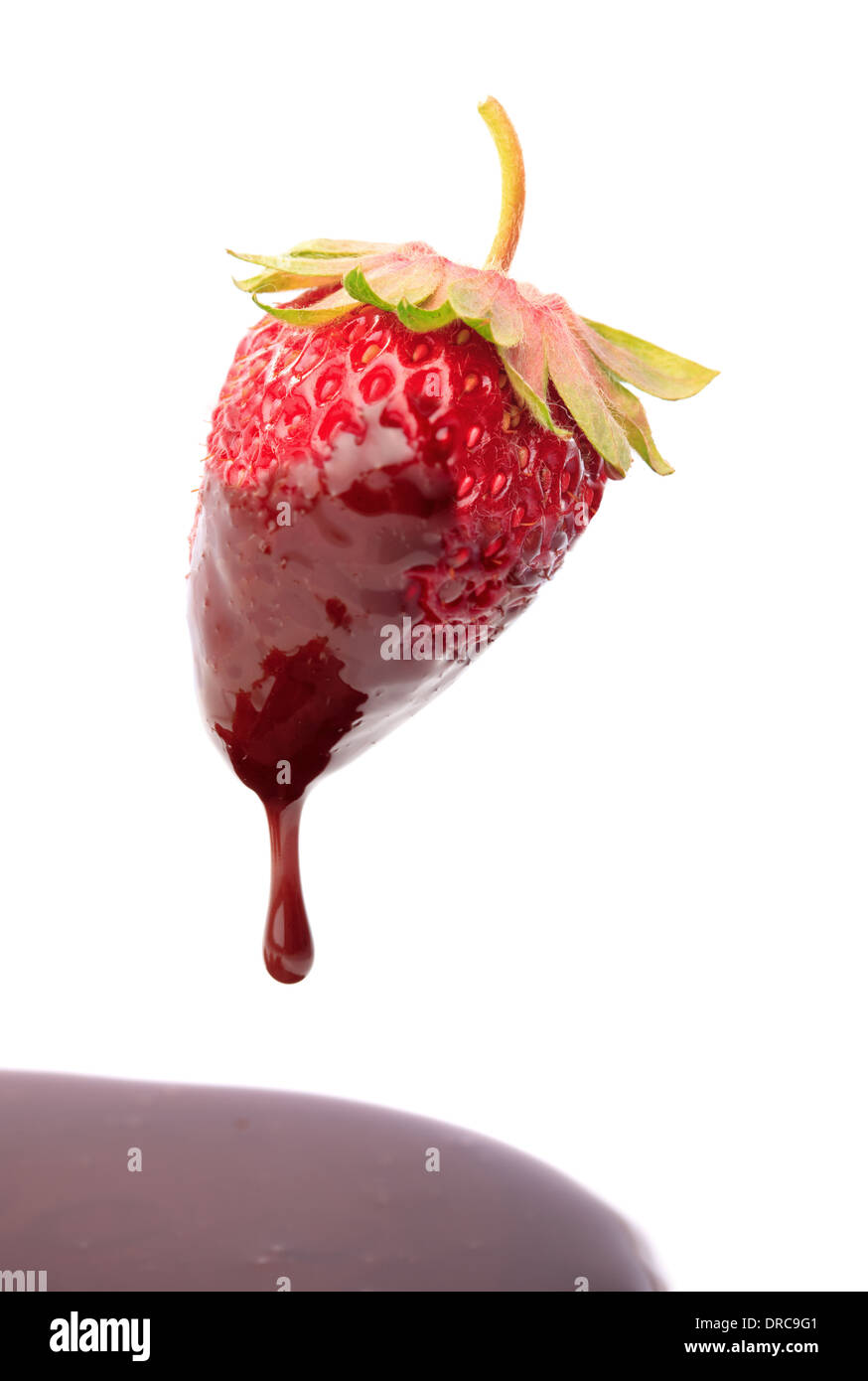 Strawberry with melting chocolate isolated on white Stock Photo - Alamy