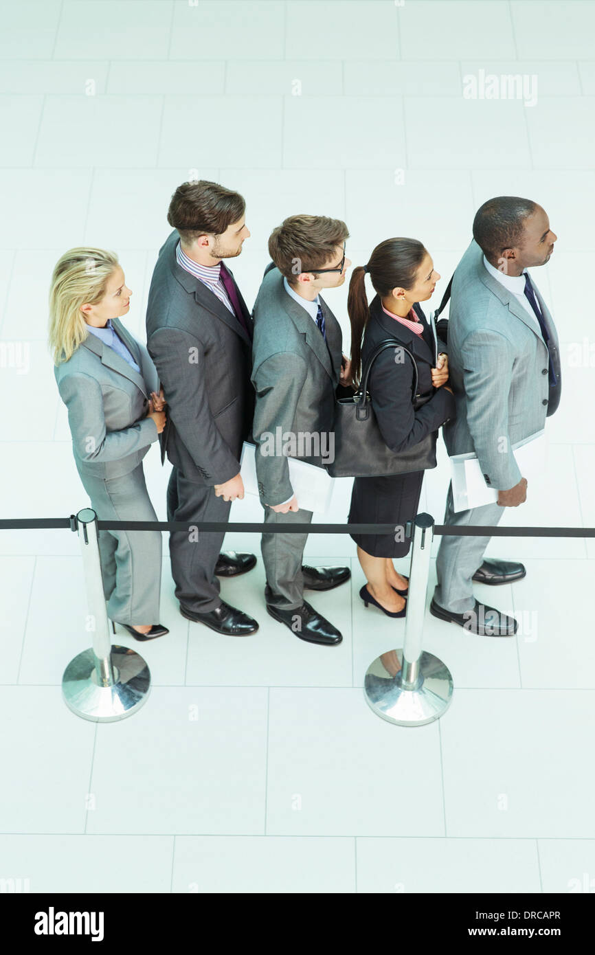 Business people waiting in line Stock Photo - Alamy