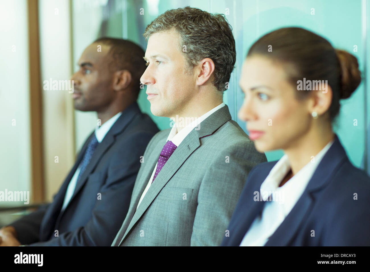 Business people sitting in waiting area Stock Photo - Alamy