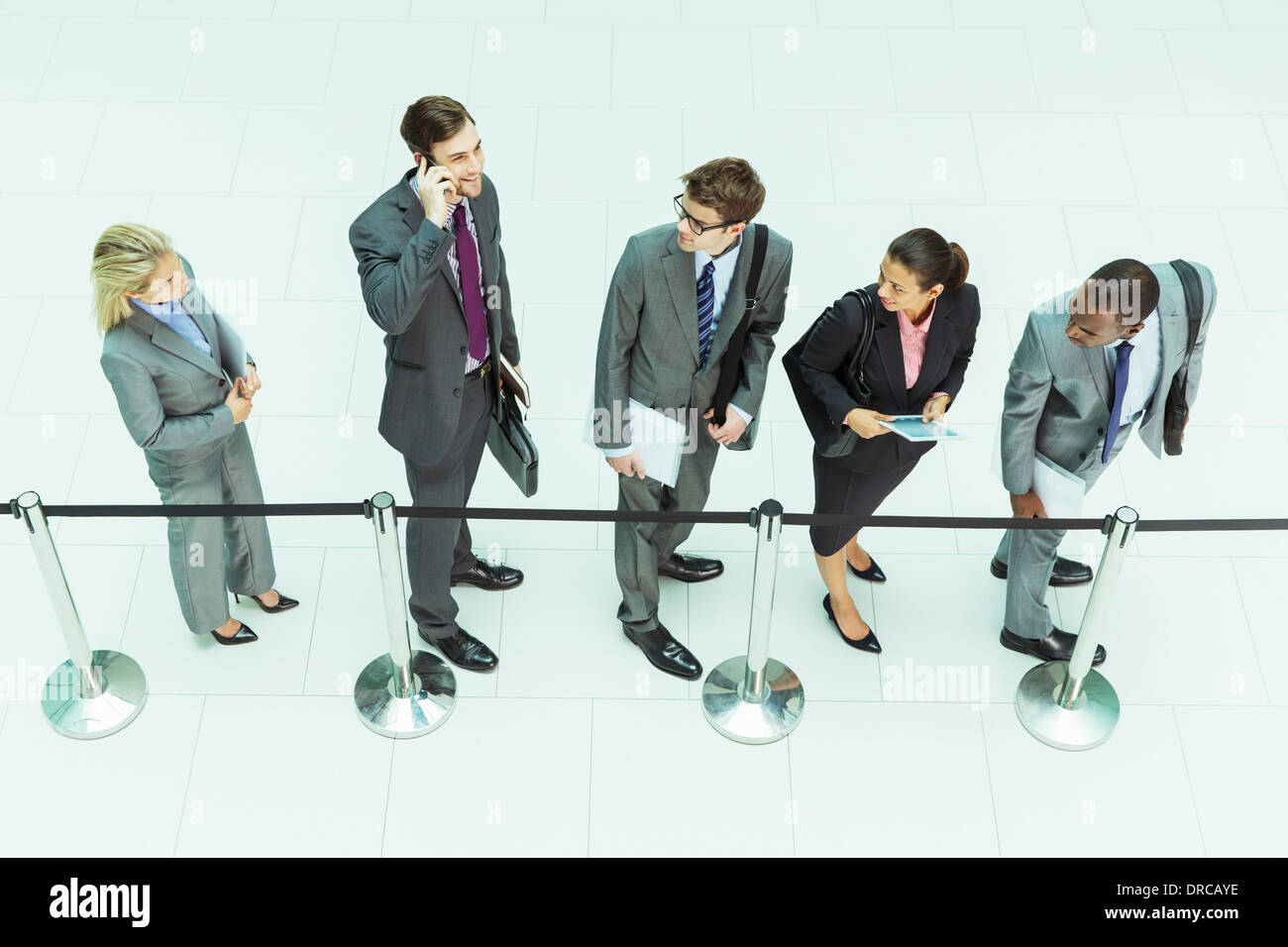 Mature woman chatting in queue hi-res stock photography and images - Alamy