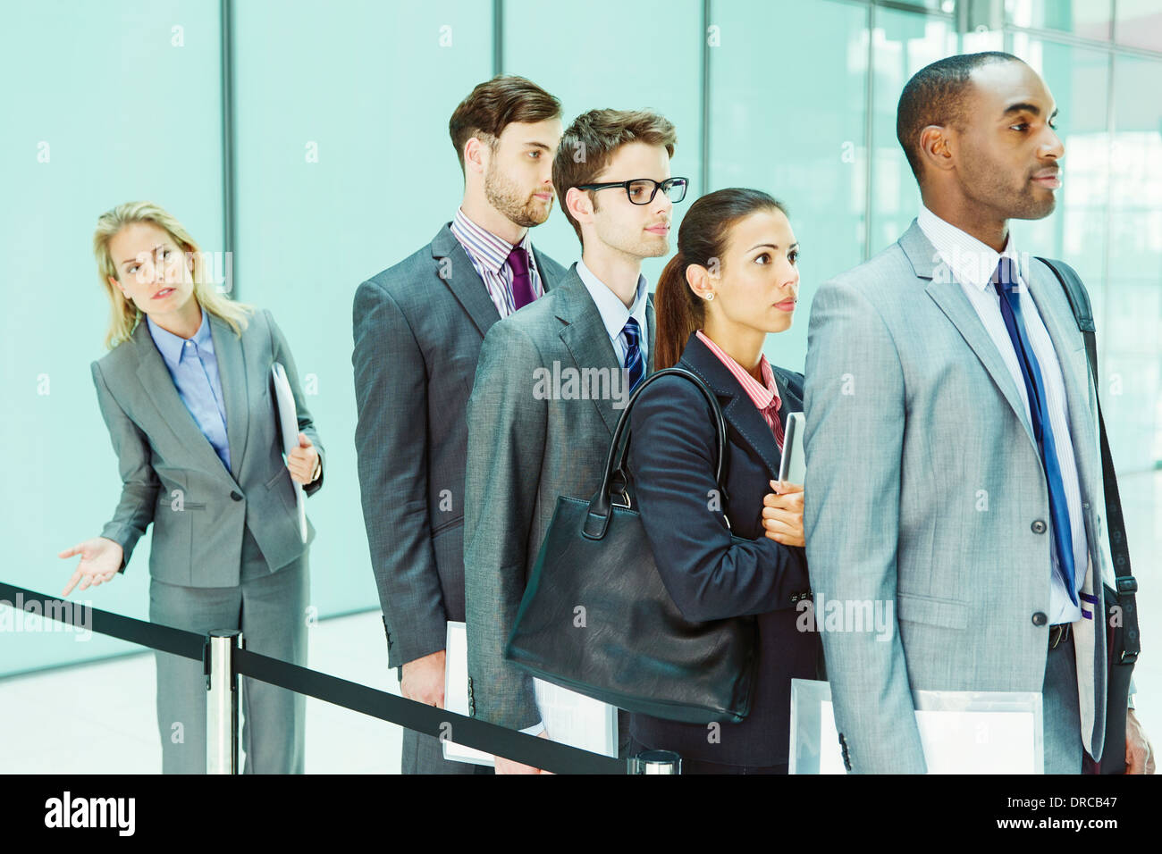 Business people waiting in line Stock Photo - Alamy