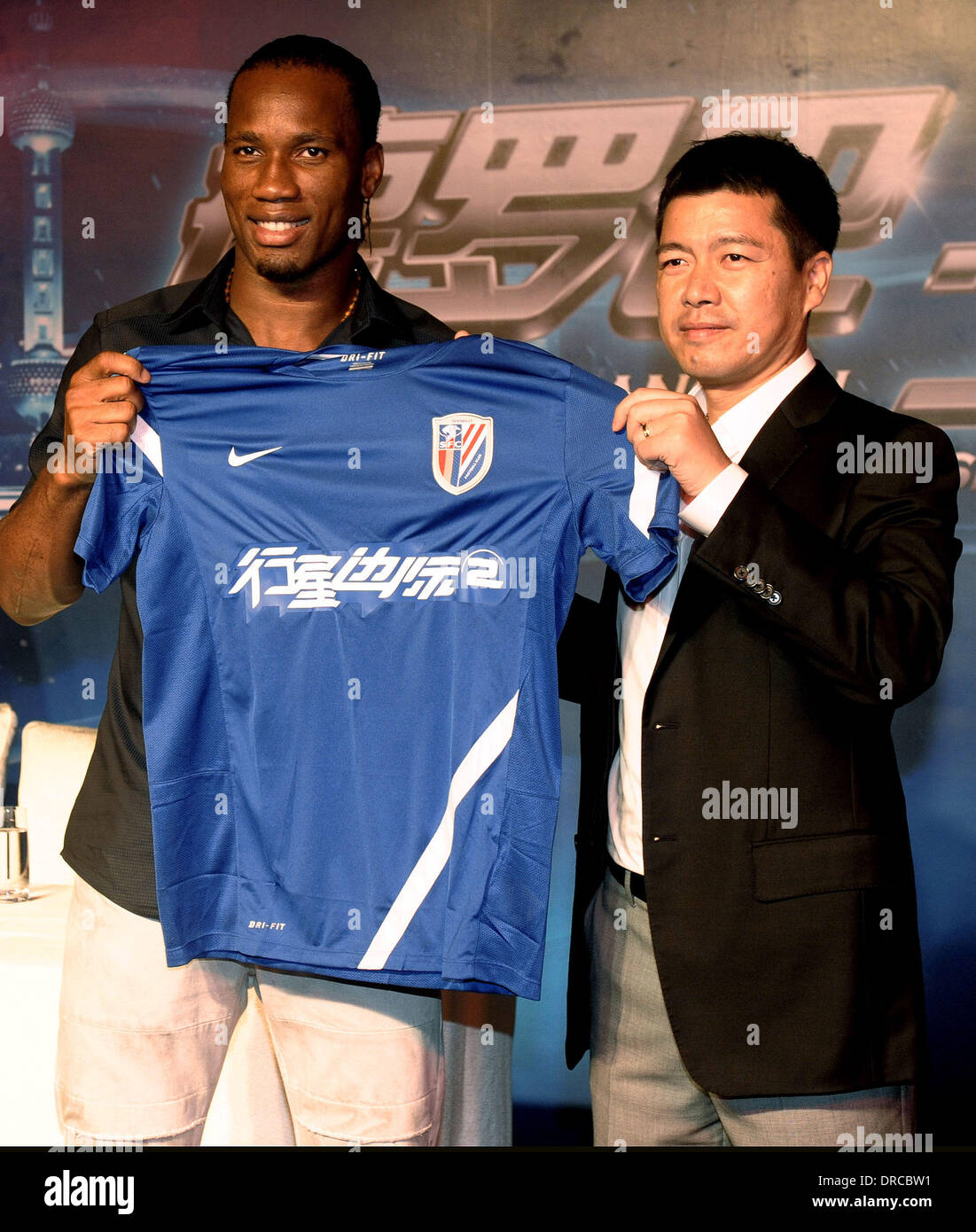 Didier Drogba and club director Zhou Jun Didier Drogba attends a press ...