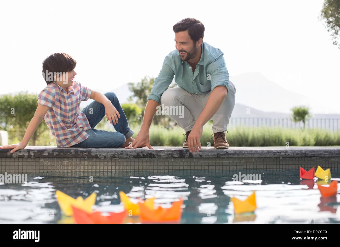 Father and son at swimming pool hi-res stock photography and images - Alamy