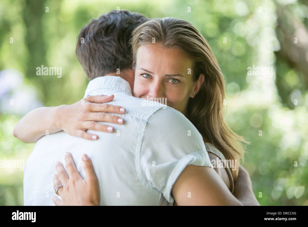 Person hugging male female not smiling hi-res stock photography and images - Alamy