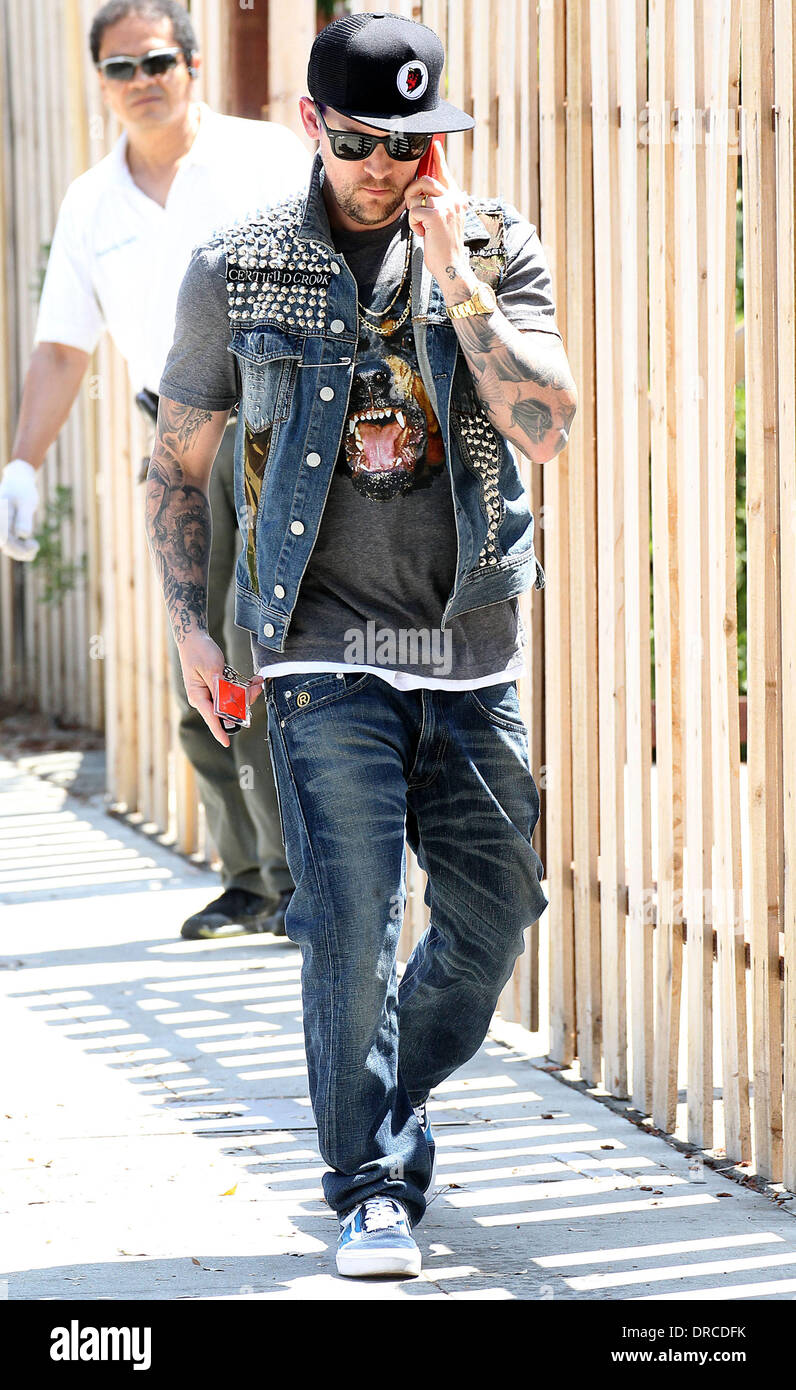 Joel Madden talks on his cell phone as he runs errands in West ...