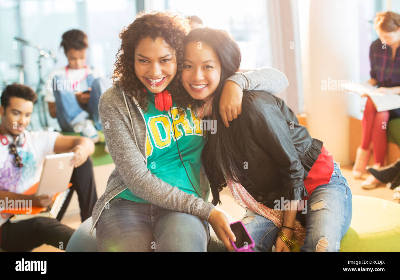 University students smiling together in lounge Stock Photo - Alamy