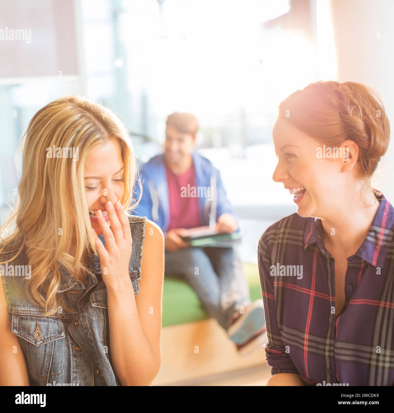 University students laughing in lounge Stock Photo - Alamy
