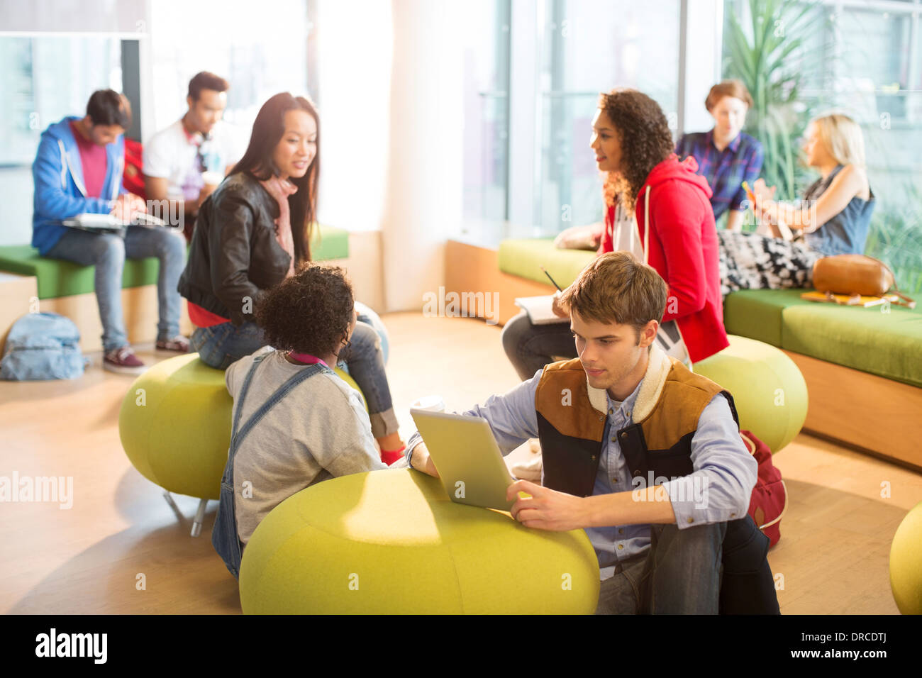University students relaxing in lounge Stock Photo - Alamy