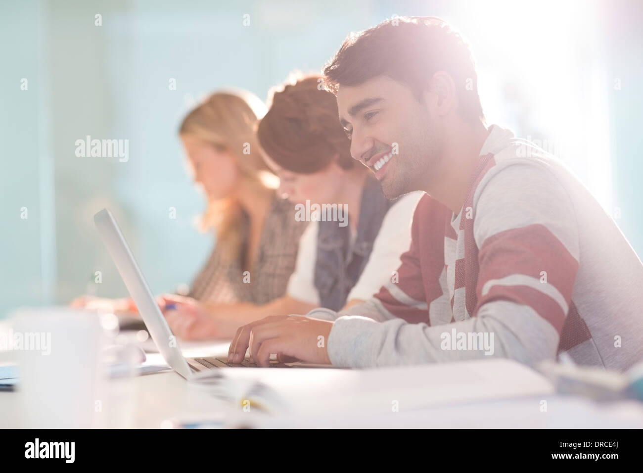 University student using laptop in classroom Stock Photo - Alamy