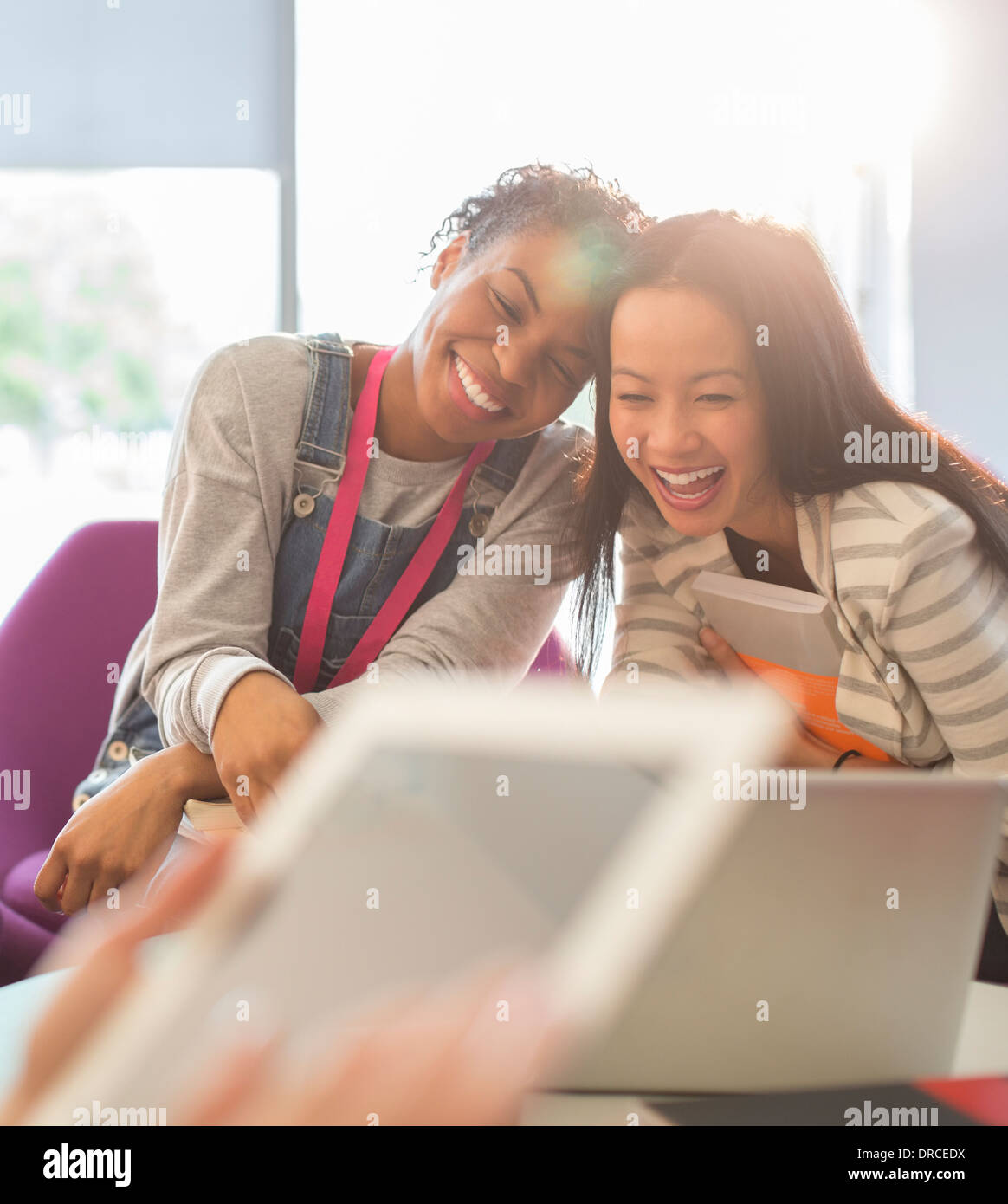 University students laughing in lounge Stock Photo - Alamy