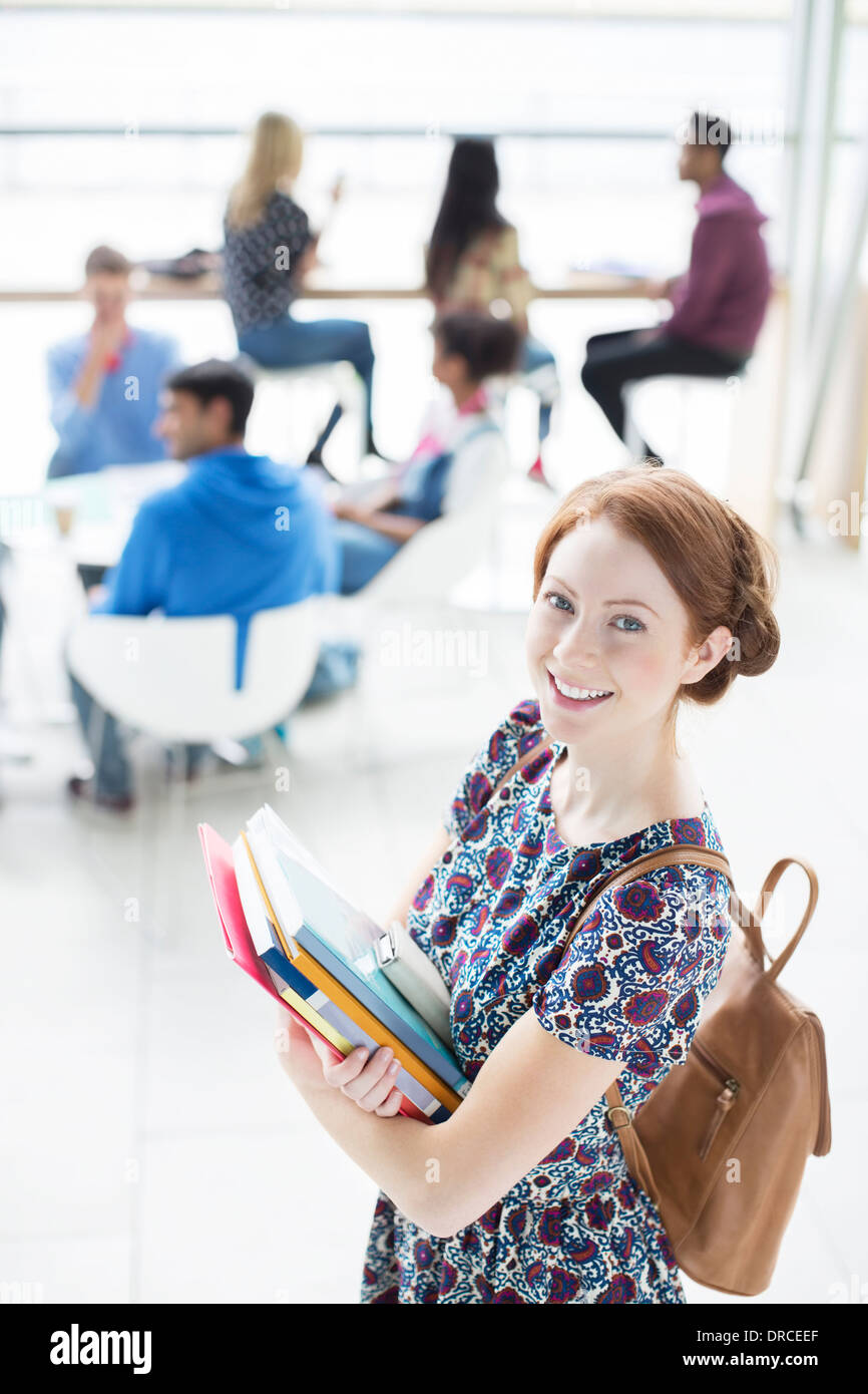 University student smiling in lounge Stock Photo - Alamy