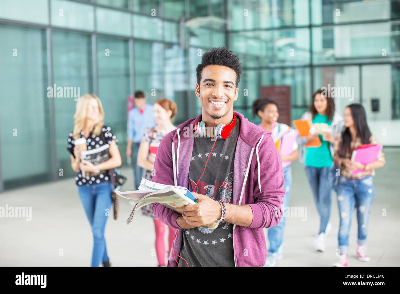 College student carrying books hi-res stock photography and images - Alamy
