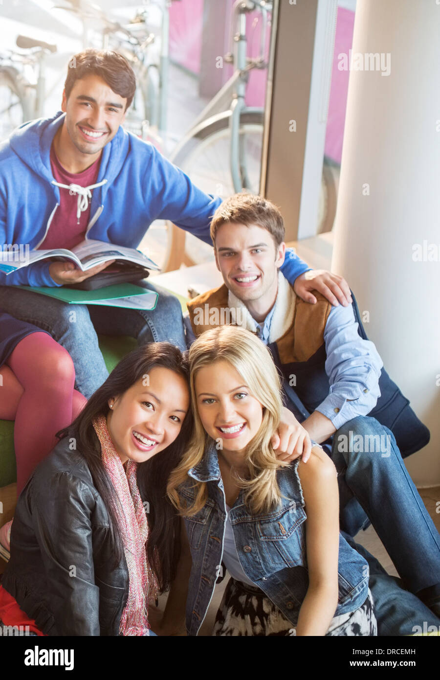 University students smiling in lounge Stock Photo - Alamy
