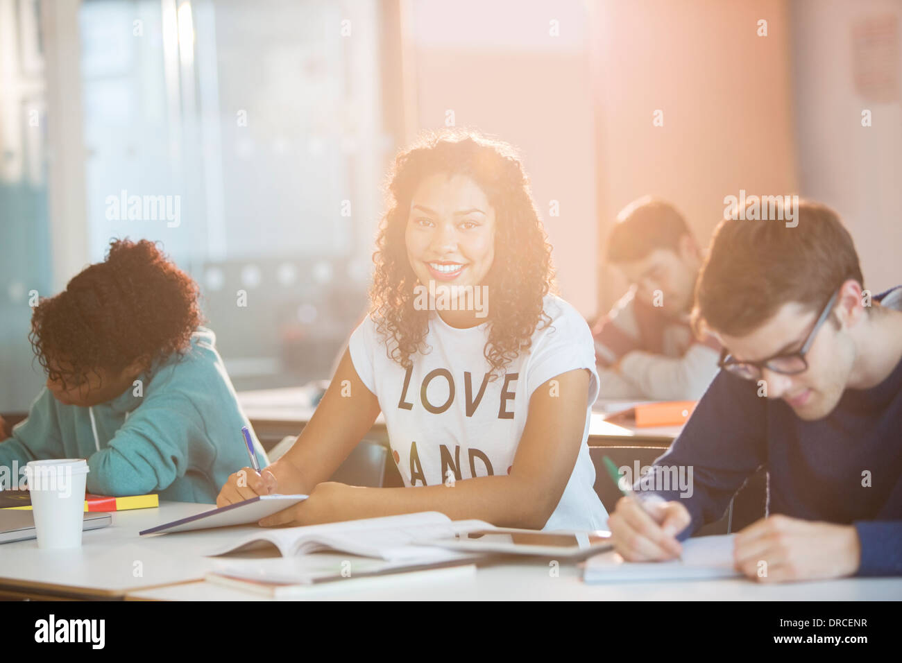 University student smiling in classroom Stock Photo - Alamy