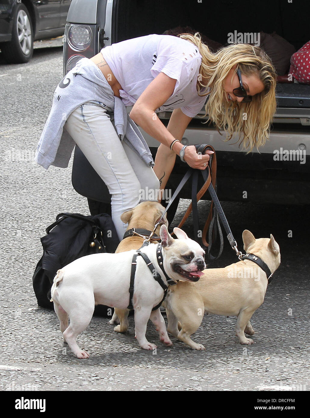 Sarah Harding packs the back of her car while out walking her dogs in ...