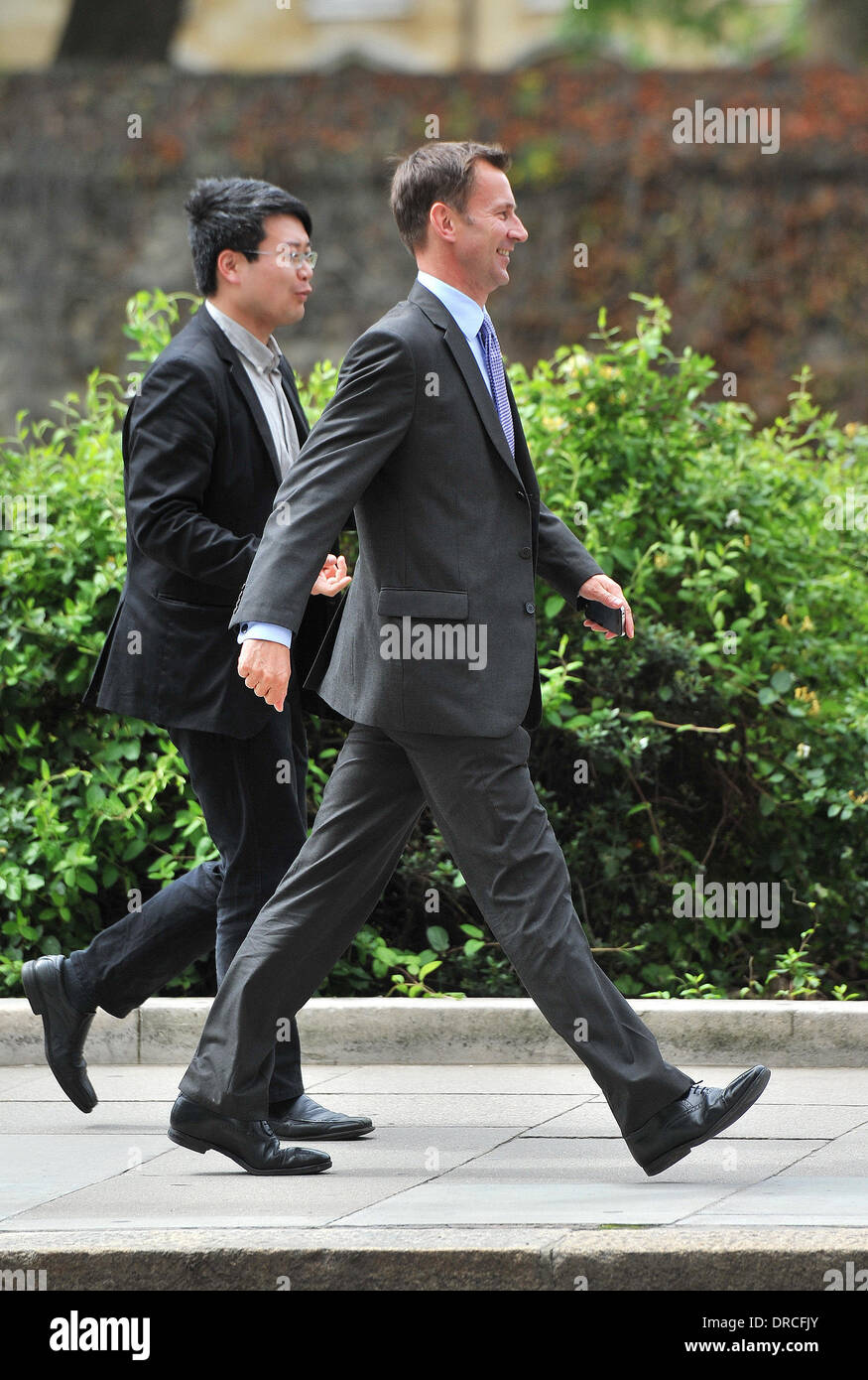 Jeremy Hunt MP is pursued by a reporter while out and about in ...