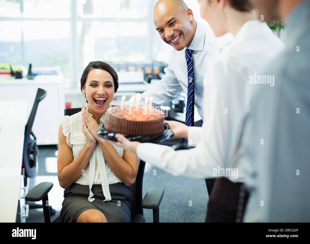 Business people celebrating birthday in office Stock Photo - Alamy