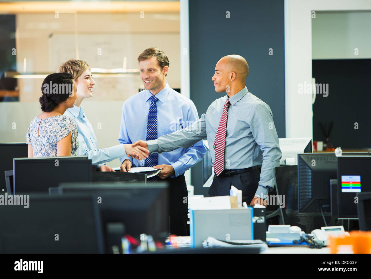 Business people shaking hands in office Stock Photo - Alamy