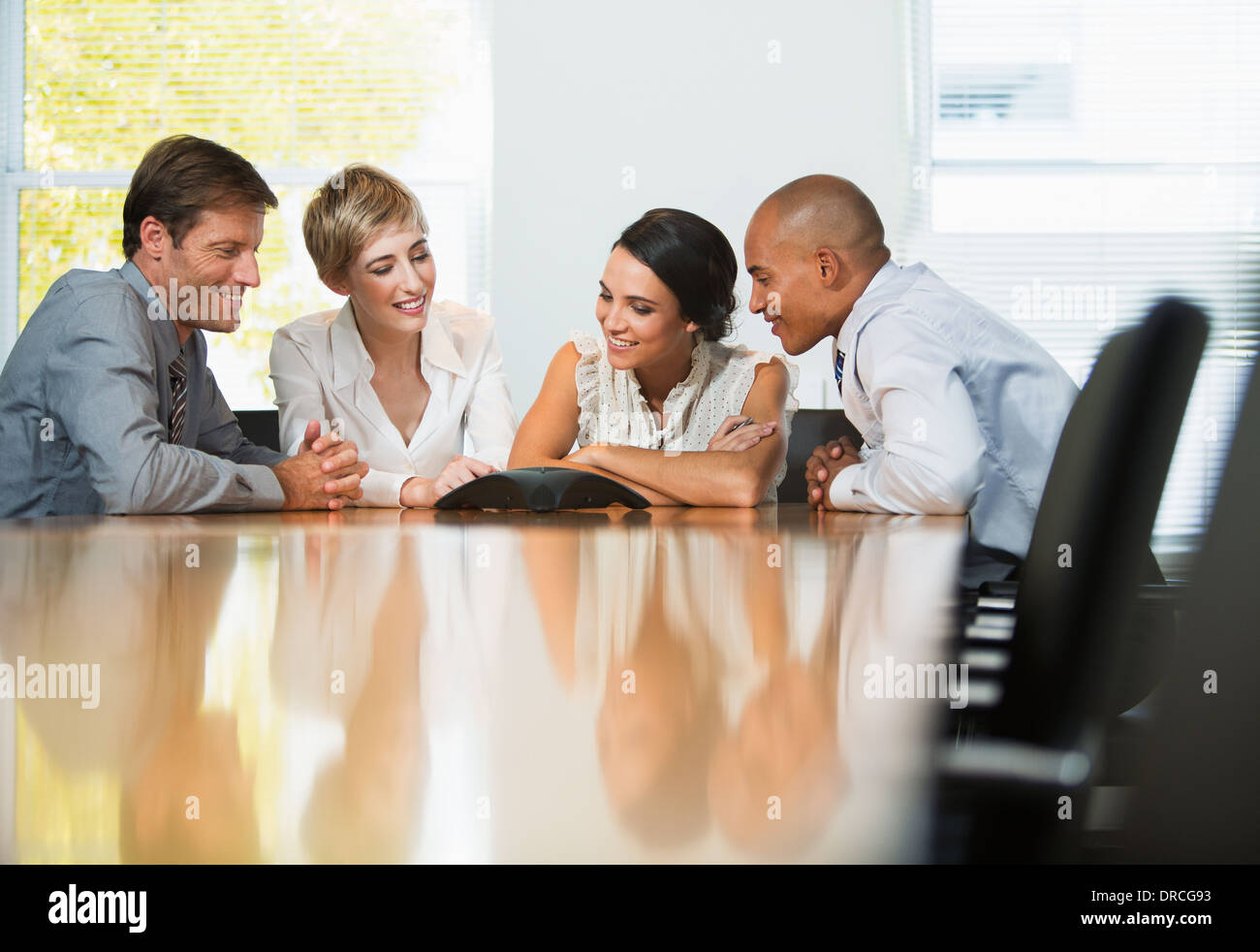 Seated at conference table hi-res stock photography and images - Alamy