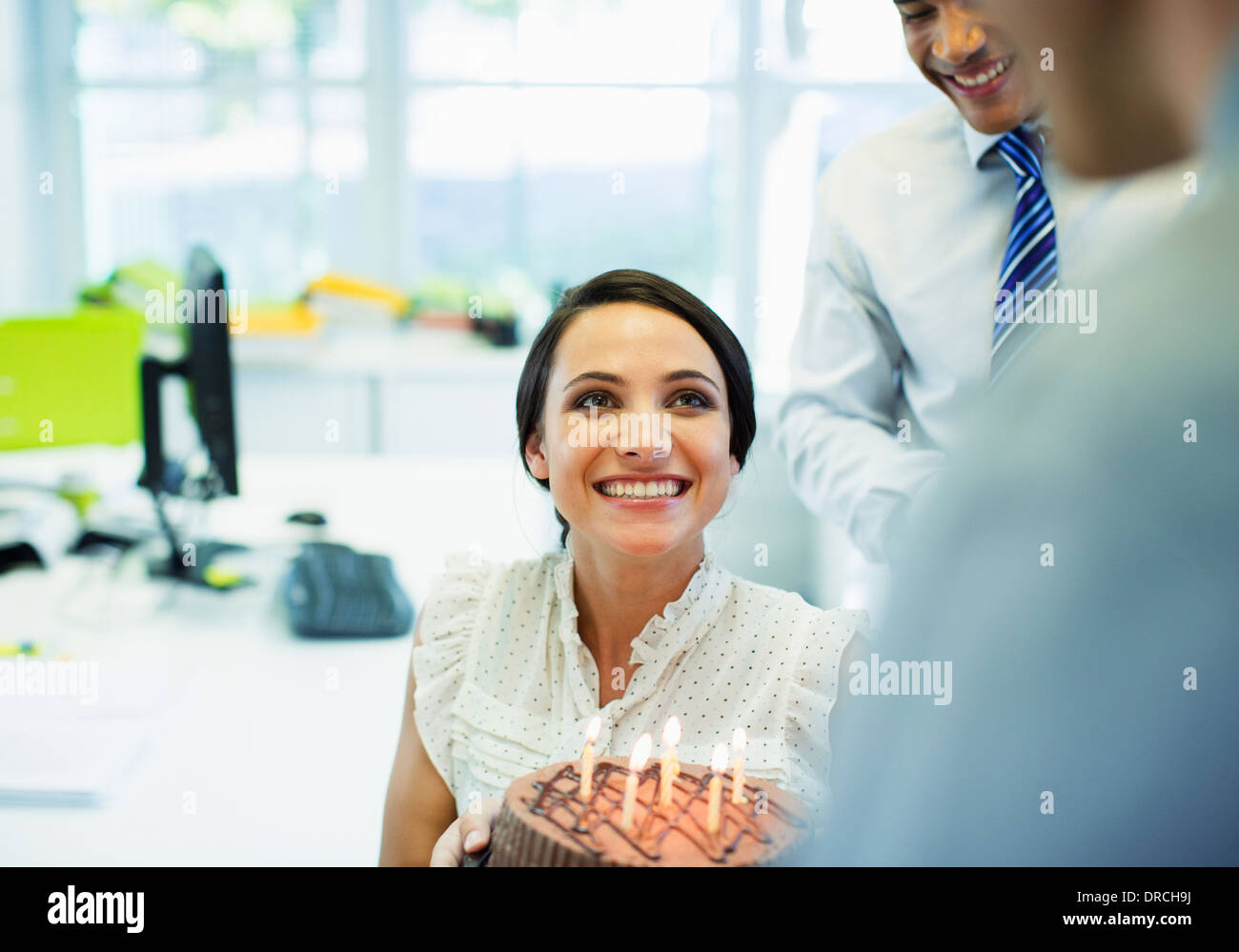 Business people celebrating birthday in office Stock Photo - Alamy
