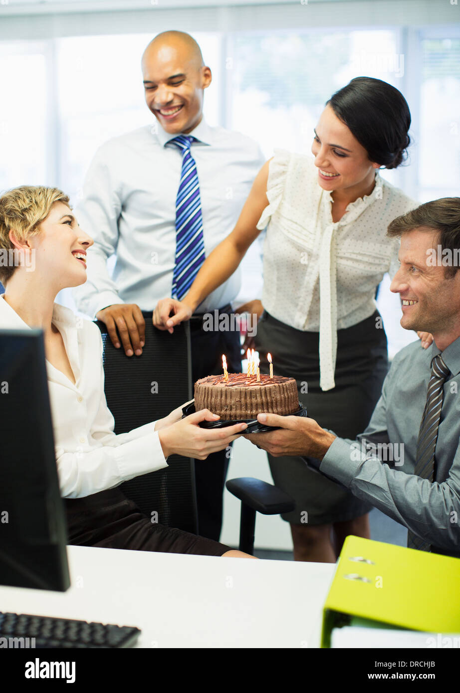 Business people celebrating birthday in office Stock Photo - Alamy