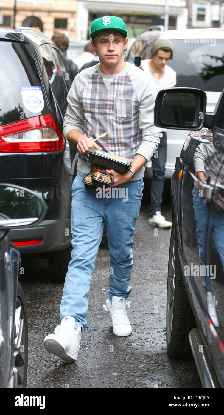 Niall Horan of One Direction leaving the Sony Music offices carrying ...