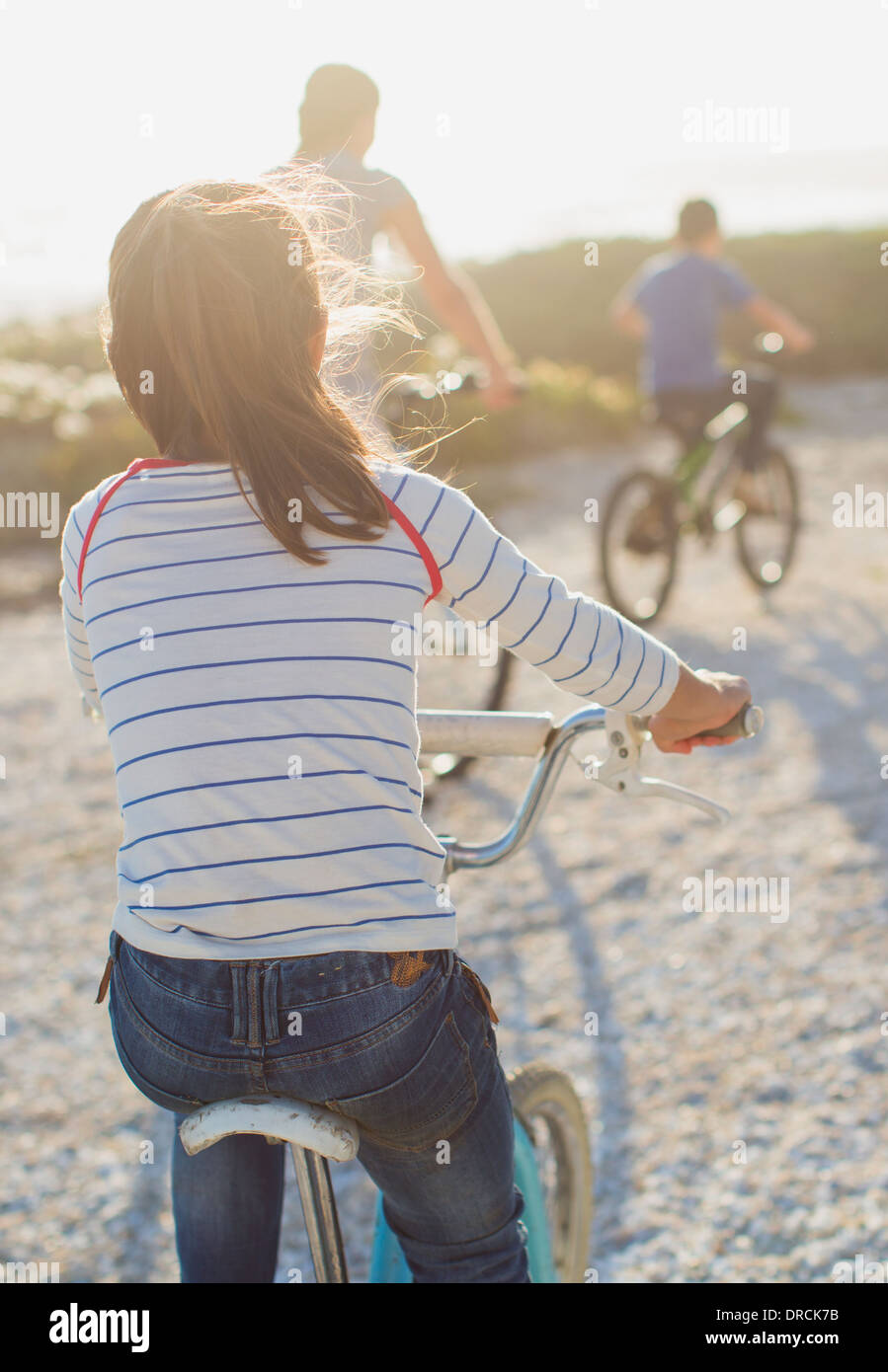 Family on beach riding bicycle hi-res stock photography and images - Alamy