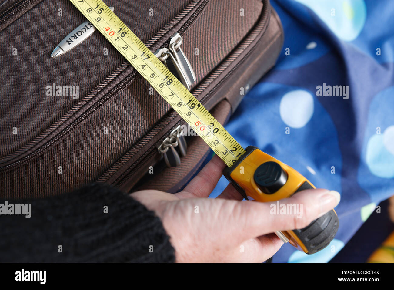 Measuring suitcase for hand luggage on a flight Stock Photo - Alamy