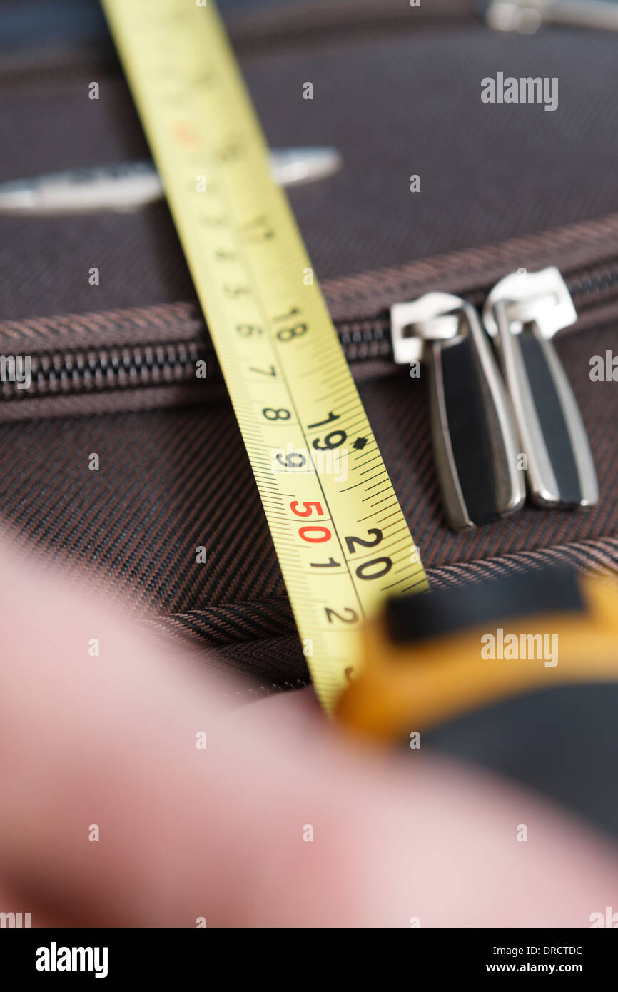Measuring suitcase for hand luggage on a flight Stock Photo - Alamy