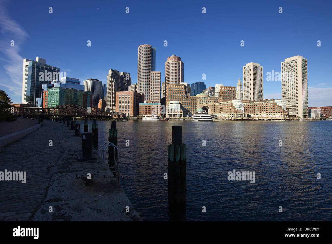 The Morning Sun on the Boston Harbor Skyline from Fan Pier Plaza with a ...
