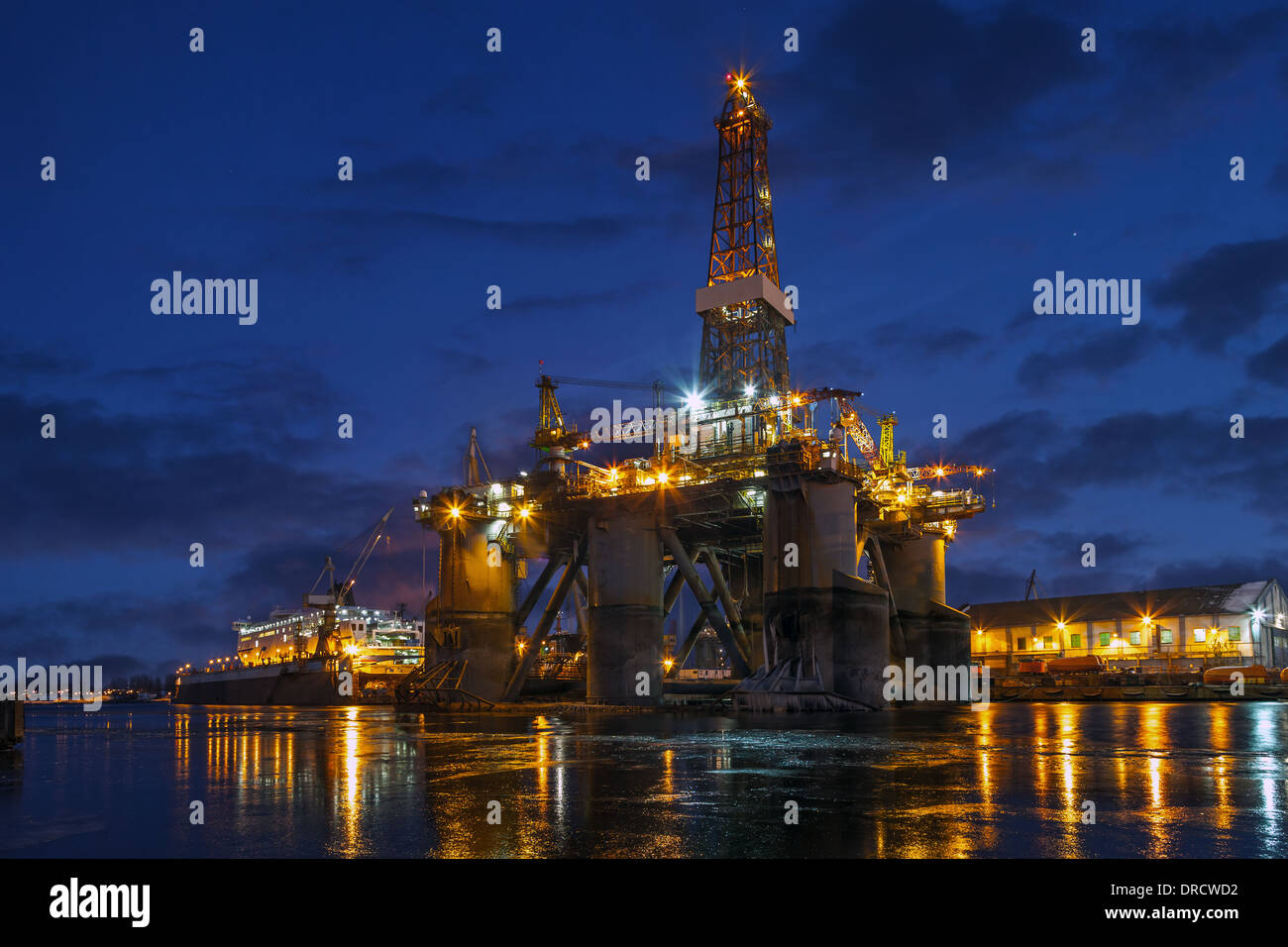 Oil rig at night in winter scenery Stock Photo - Alamy