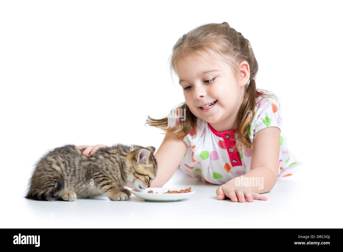 happy child feeding kitten Stock Photo - Alamy