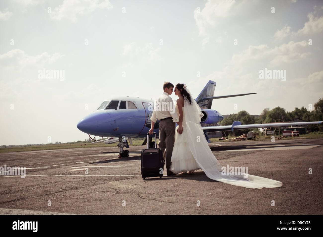 Wedding couple are prepare to fly on a honeymoon trip Stock Photo - Alamy