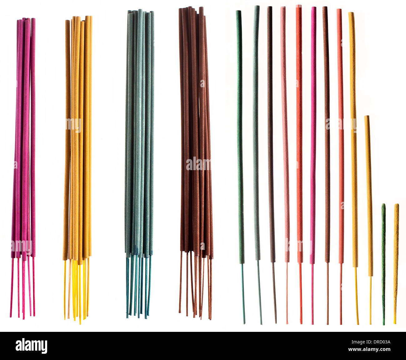 Colourful incense sticks grouped and singles isolated on white ...