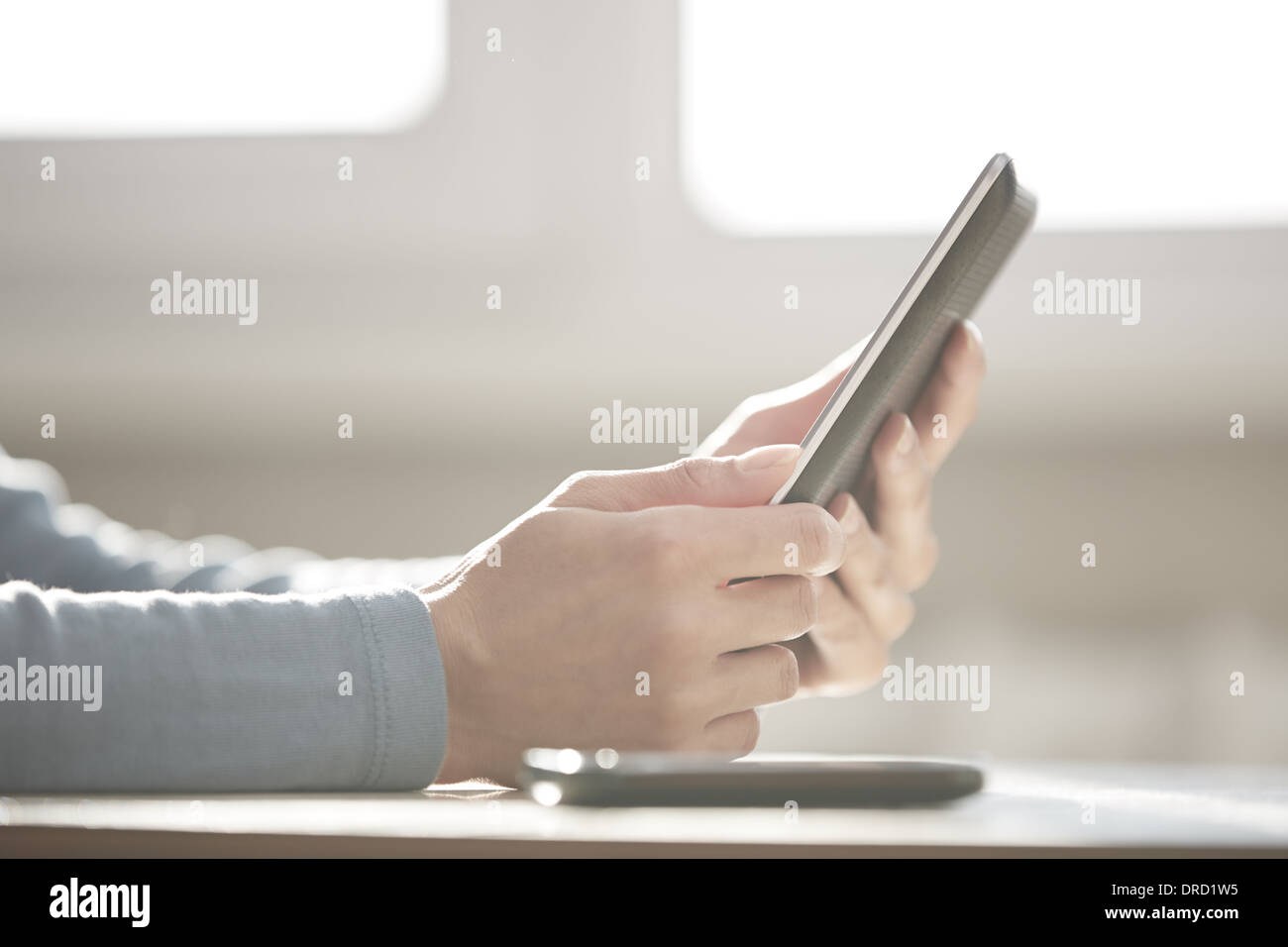 Human hands using tablet computer at home Stock Photo - Alamy