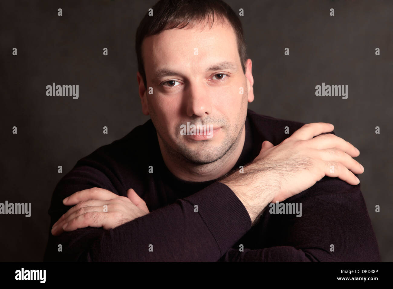 Studio portrait of man isolated on grey background Stock Photo - Alamy